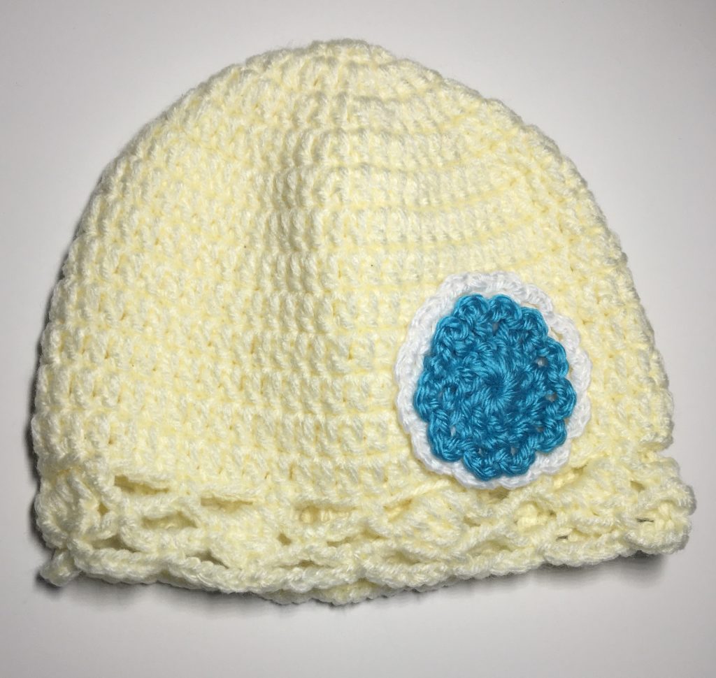 Pale Yellow Hat with Blue Flower – Toasty Toppers